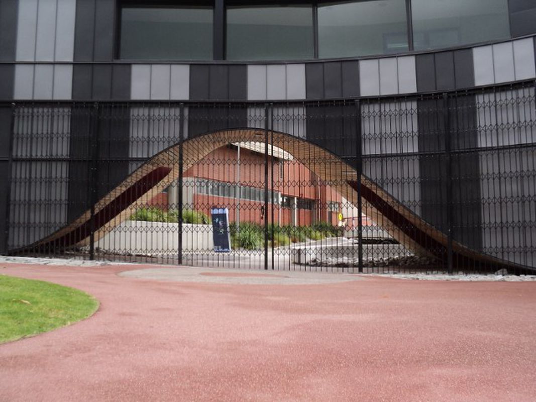 Curved concertina trellis security doors secure Infinity Centre ...